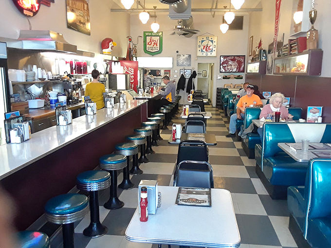 Blue vinyl booths that have cradled generations of Mansfield residents through first dates, family celebrations, and morning-after recoveries.