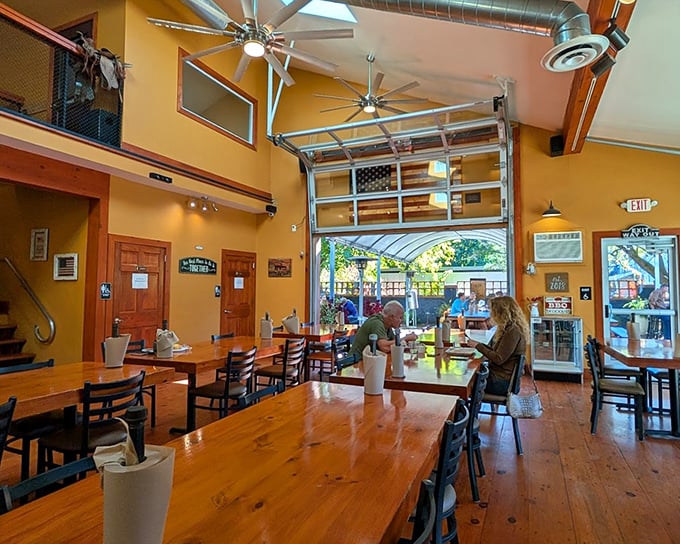 The garage door that opens to the outdoors says "we're casual," but those wooden tables and American flag say "we're serious about our craft."