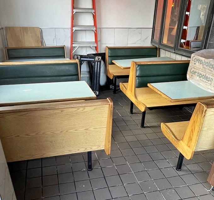 Simple wooden booths tell you to focus on what matters: the food, not fancy surroundings. This is sandwich appreciation in its purest form.