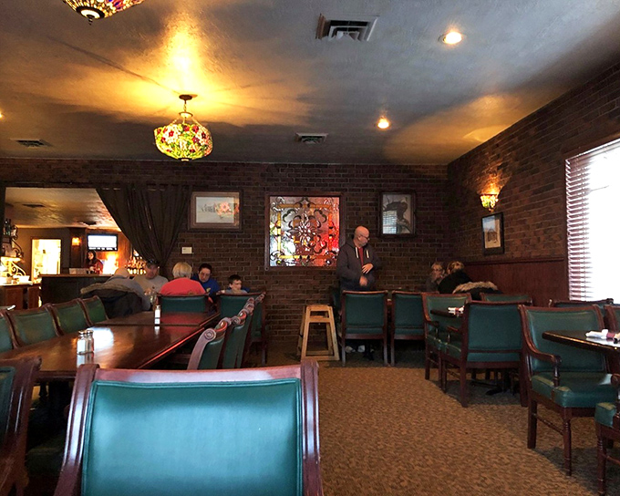 The dining room's stained glass accents and brick walls create the perfect backdrop for the real star of the show&mdash;whatever's about to land on your plate.