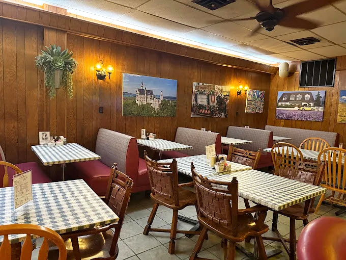 Red booths and wooden tables create the perfect backdrop for food that doesn't need Instagram filters to impress.