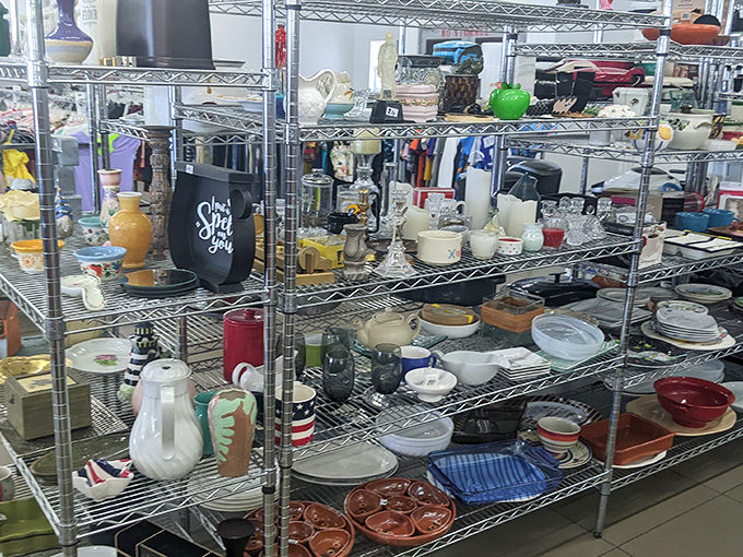 Shelves of everyday dinnerware mingle with occasional treasures. That milk glass pitcher would look perfect filled with sweet tea on your porch.