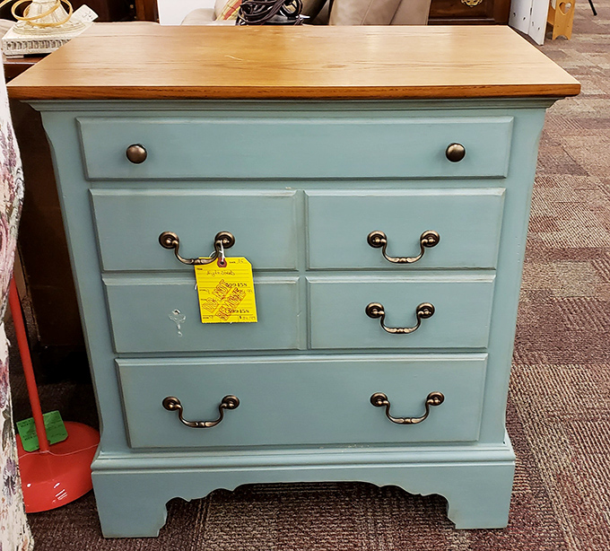 This seafoam dresser with honey-colored top proves someone's DIY project can become your statement piece without the sanding, painting, or cursing.