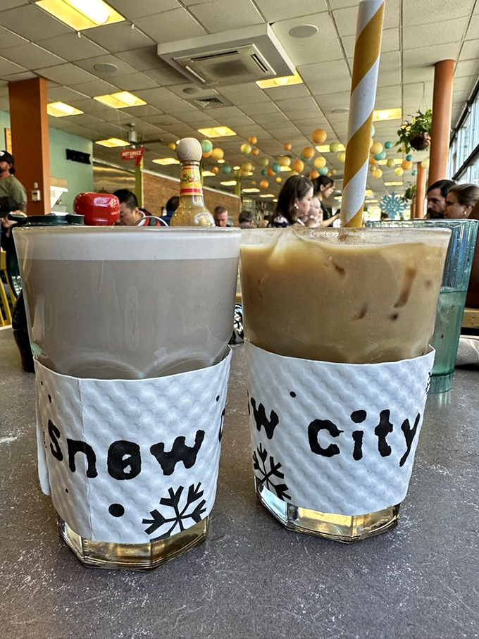 Coffee and its creamy counterpart, wearing their Snow City sleeves like fashionable winter coats. Caffeine never looked so appealing.
