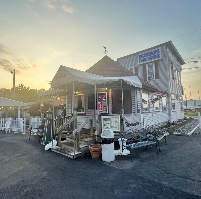 Sunset casts a golden glow on Brennan's entrance, transforming this humble fish house into something straight out of a coastal painting.