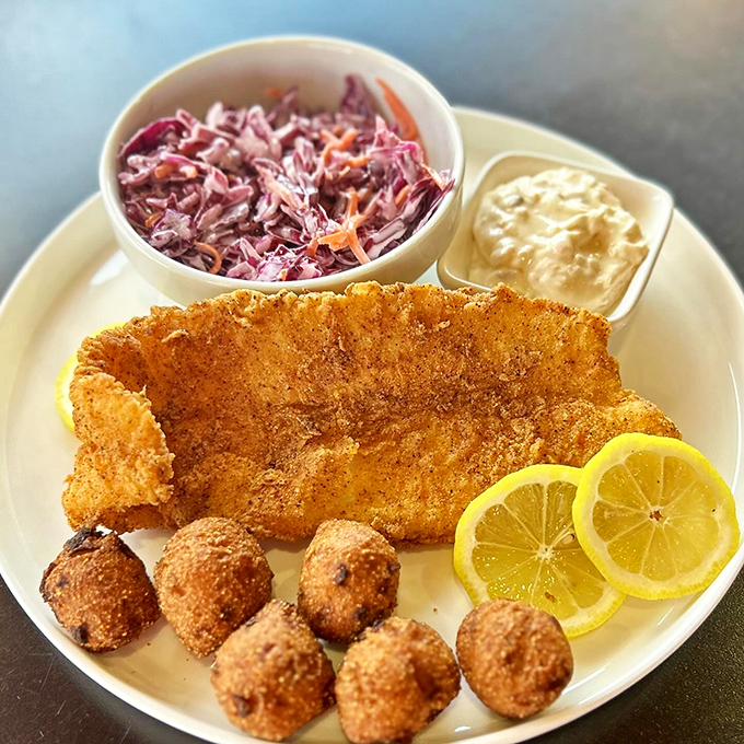 Not just any fish fry—a golden-crusted revelation with hushpuppies standing guard. Even landlocked diners rejoice.