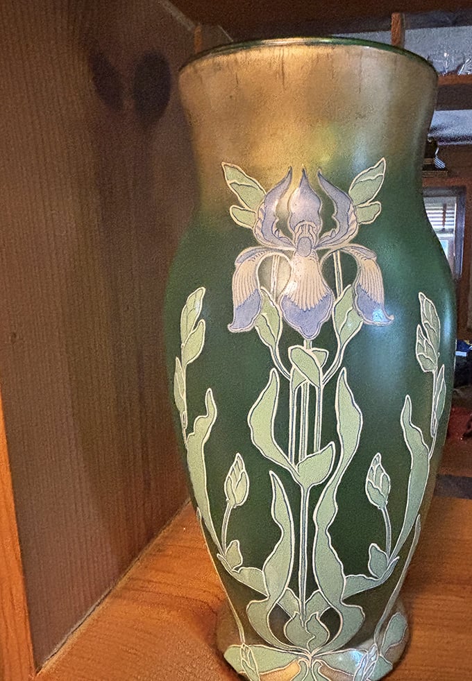 This Art Nouveau-inspired green vase with delicate iris design isn't just decorative&mdash;it's functional artwork that survived decades of changing tastes. 