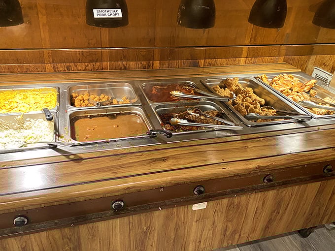 The buffet line showcasing golden fried chicken, rich gravies, and sides that rotate daily—basically Louisiana's greatest hits under heat lamps.