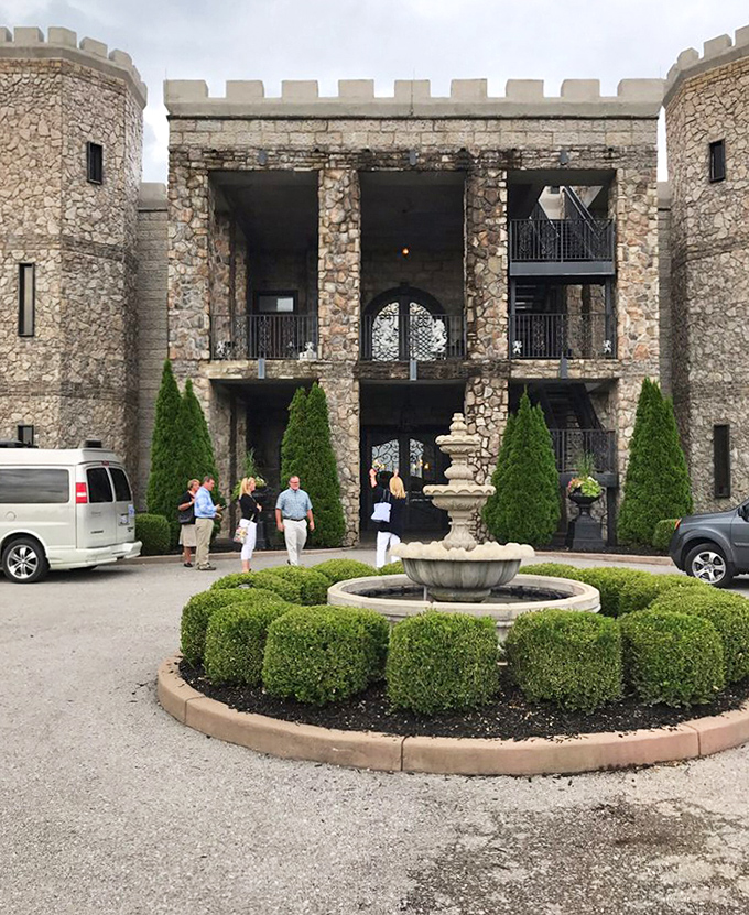 The castle's impressive stone fa&ccedil;ade features round turrets that would make any medieval architect tip their historically accurate hat in approval.