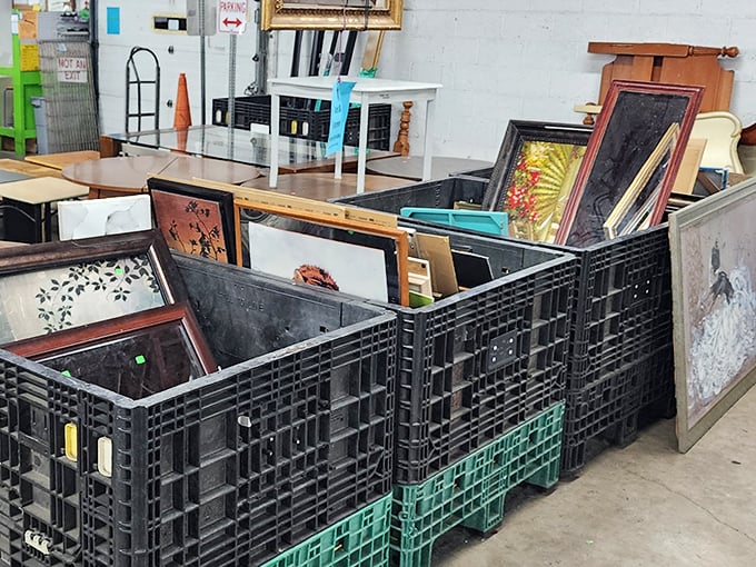 Art gallery or thrift store find? These framed pieces wait patiently in their plastic bins for the perfect wall.