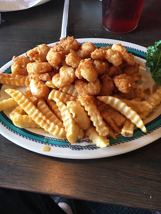 The perfect marriage of golden-fried shrimp and crinkle-cut fries &ndash; a plate that says "vacation" more clearly than your out-of-office email.