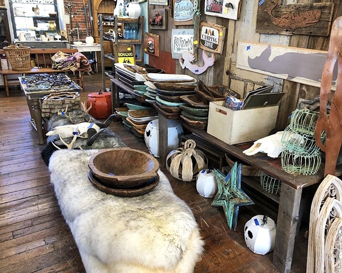 Rustic bowls nestled on fur throws—a tactile wonderland where modern farmhouse meets primitive chic. Touch everything (but carefully).