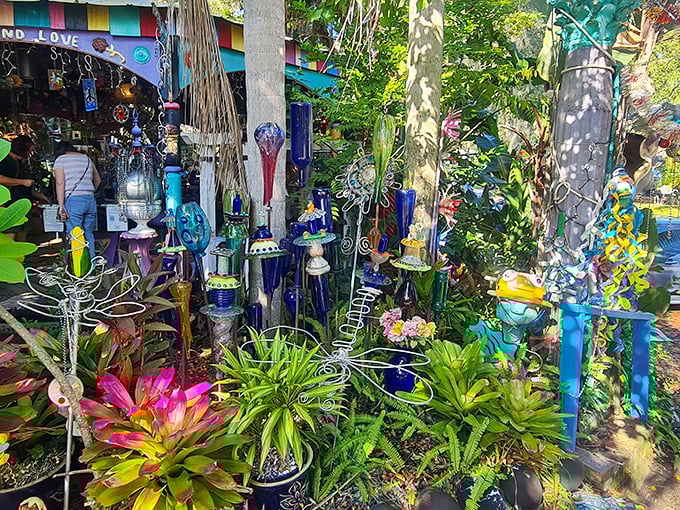 The bottle tree garden catches light like nature's own disco ball. These blue glass treasures transform ordinary sunbeams into extraordinary light shows.