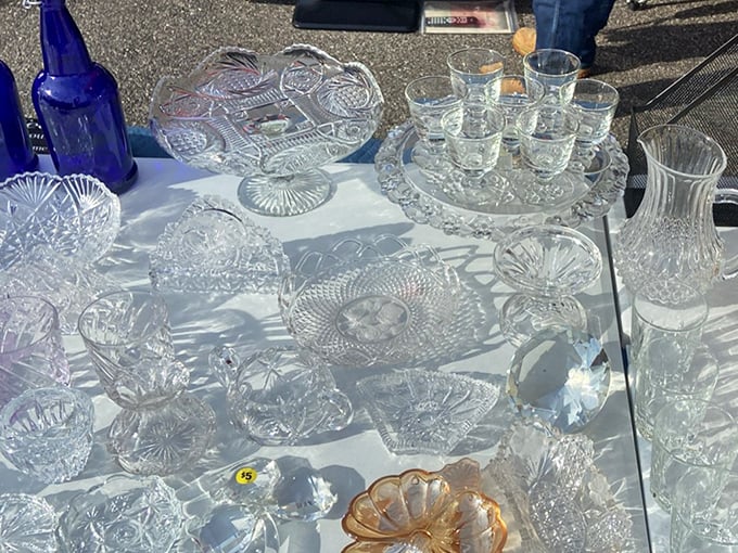 Crystal and glassware catch the sun like diamond facets. These elegant vessels once toasted special occasions and now await new celebrations.