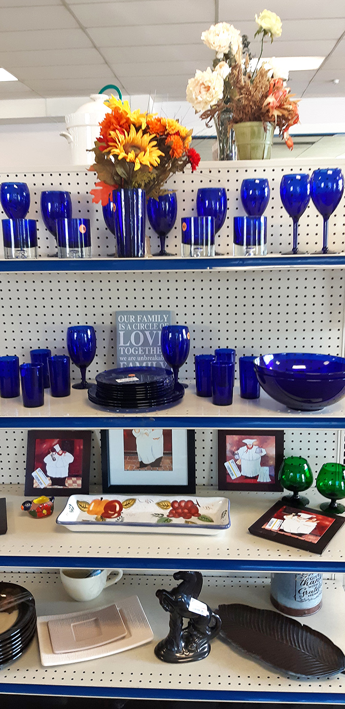 Cobalt blue glassware catching the light like tiny pieces of captured sky waiting to grace someone's dinner table. 
