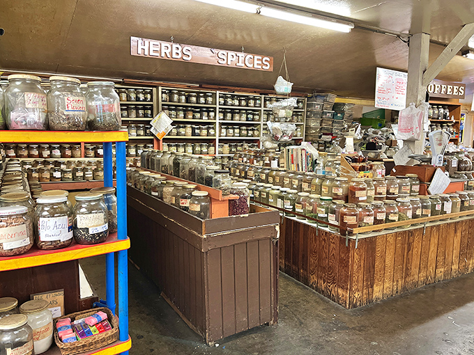 Herbs and spices fill jars and containers, turning this humble booth into an aromatic adventure for home chefs everywhere.