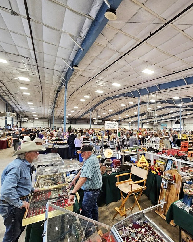 The indoor pavilion stretches as far as the eye can see, with vendors and shoppers engaged in the timeless dance of commerce.