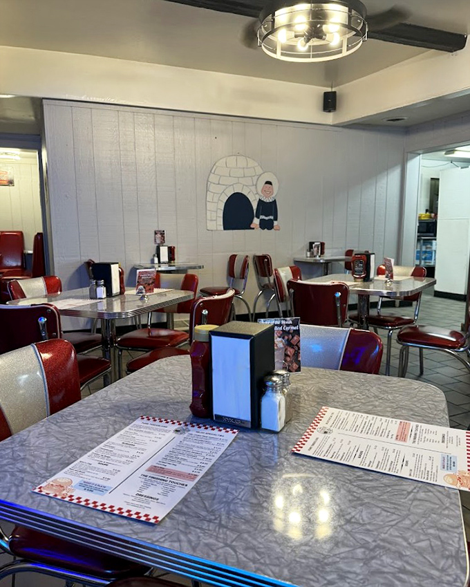 Empty tables waiting for the lunch rush &ndash; each one a blank canvas for future food memories and coffee cup rings.