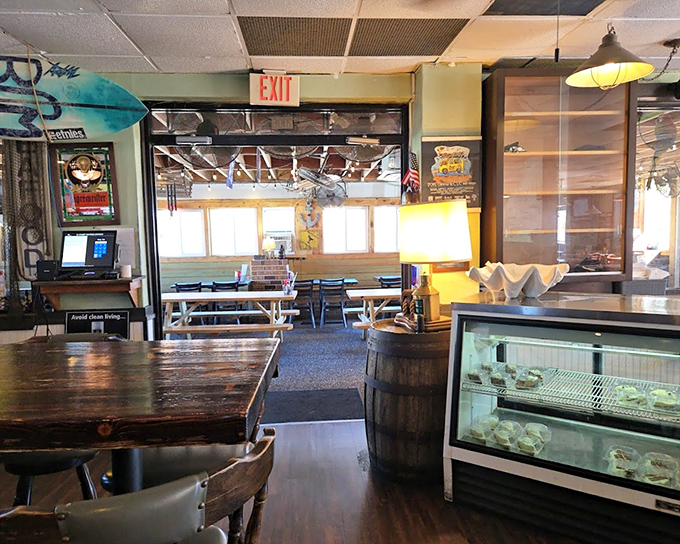 Where surfboards meet seafood displays. The raw bar gleams with promise while wooden barrels remind you that good things come to those who wait.