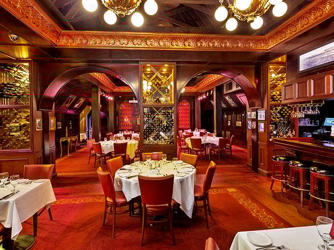 Rich wood arches frame this dining room like a portal to the era when restaurants knew the value of both elegance and comfort.