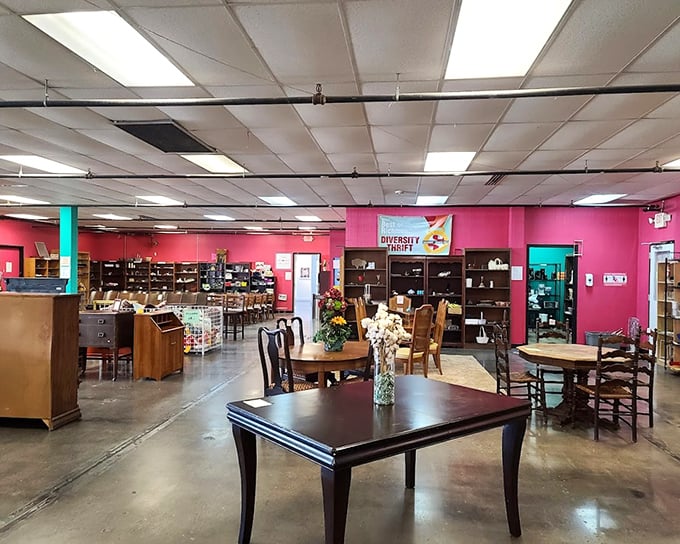 Bright pink walls create the perfect backdrop for this treasure trove of dining tables, each one silently holding stories of family dinners past.