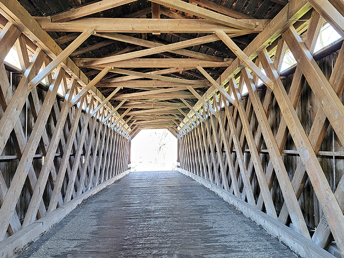 Inside the bridge, a cathedral of wooden lattice work demonstrates the brilliant simplicity of 19th-century engineering solutions.