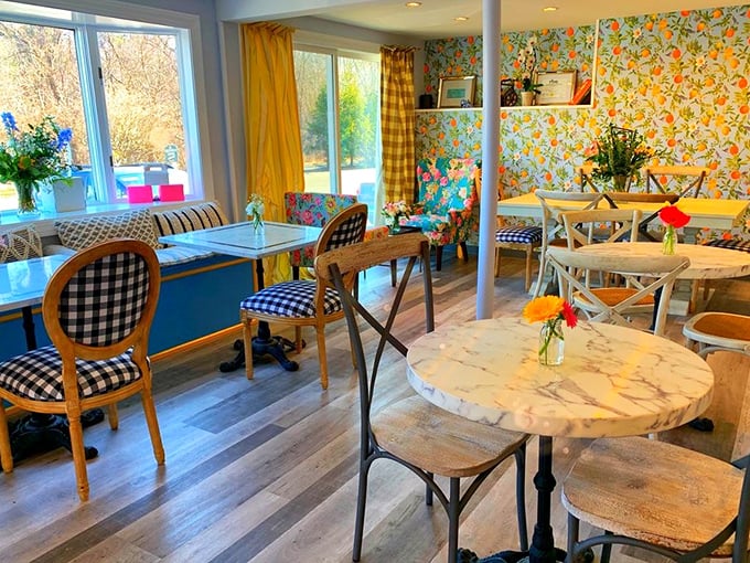 Floral wallpaper meets marble tabletops in a space that feels like your stylish grandmother's living room—if she were a master pastry chef.