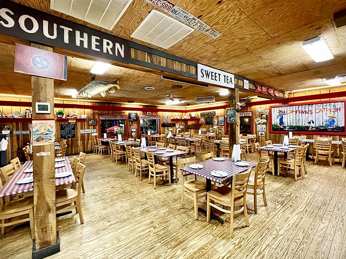 The dining room feels like a Southern community gathering spot where strangers become friends over shared platters and "pass the hushpuppies" becomes a bonding ritual.