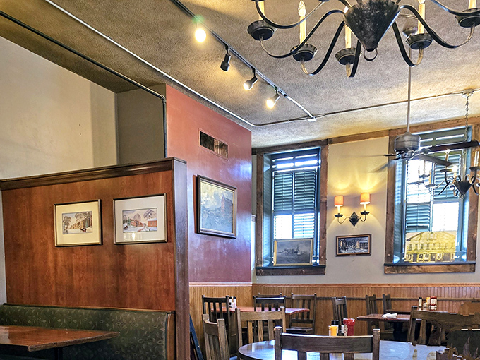 Wooden beams, warm lighting, and thoughtfully placed artwork create the kind of atmosphere where memories are made between bites.