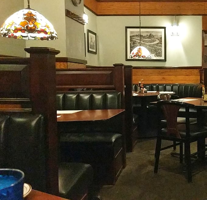 Stained glass lamps cast a warm glow over leather booths&mdash;creating dining spaces that feel like private sanctuaries for serious eating.