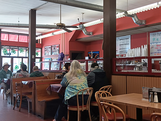 The dining room hums with conversation and nostalgia. Those wooden booths have witnessed first dates, family celebrations, and everyday meals turned special.