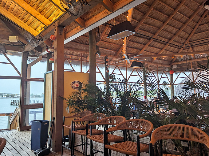Wooden beams, thatched ceiling, and tropical vibes—it's like dining in a treehouse built by someone who really understands ambiance.