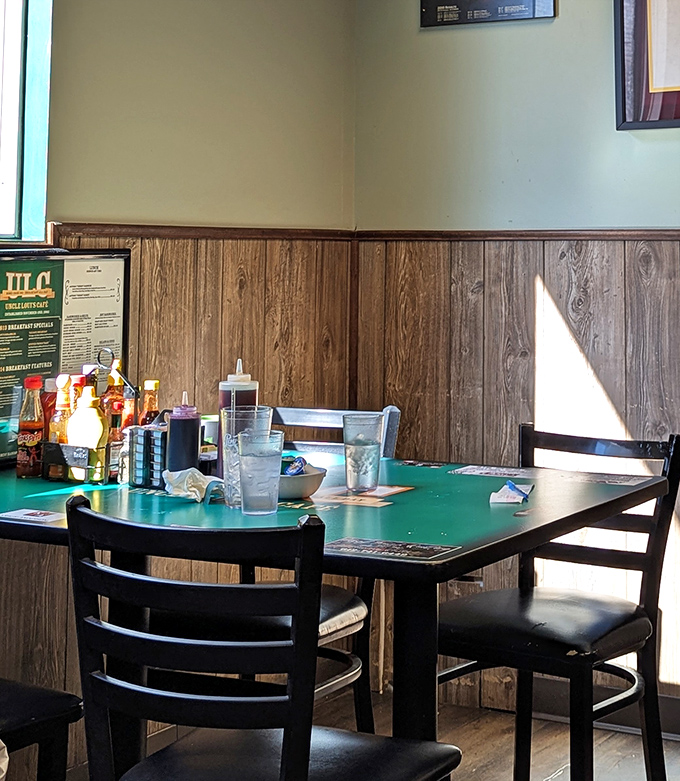 Sunlight streams through the window, illuminating a classic diner table set with the essentials&mdash;condiments standing ready like soldiers awaiting orders.