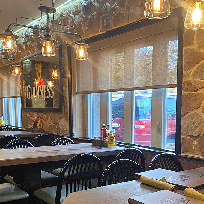 Edison himself would approve of these pendant lights illuminating stone walls that make every meal feel like a special occasion.