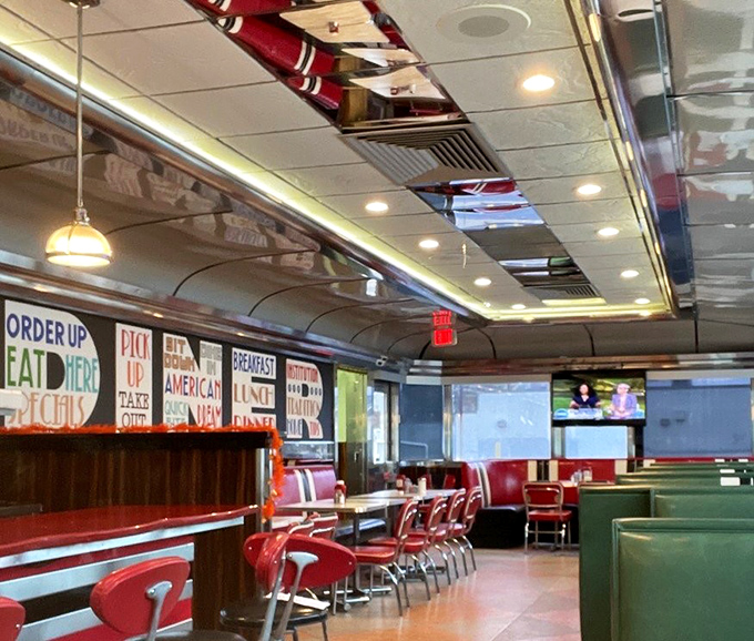 Red booths that have cradled countless conversations, with a wall mural spelling out all the delicious possibilities awaiting your appetite.