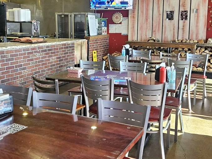 No-nonsense tables, stacked firewood, and that unmistakable aroma&mdash;the holy trinity of proper barbecue ambiance is alive and well here. 