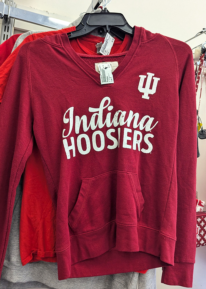 Hoosier pride hangs by the hanger. This crimson sweatshirt carries both team spirit and the faint echoes of tailgate parties past.