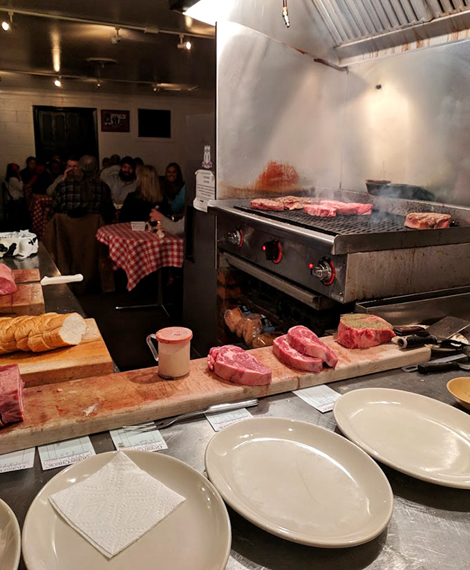 Where the magic happens. Thick cuts sizzling on the grill while raw masterpieces await their fiery transformation.