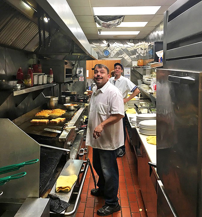 Kitchen choreography in action &ndash; where hash browns dance and eggs perform their morning ballet.