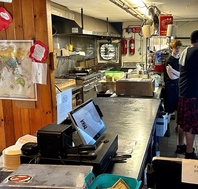 Where the magic happens! A glimpse into the kitchen reveals the organized chaos behind your seafood euphoria.