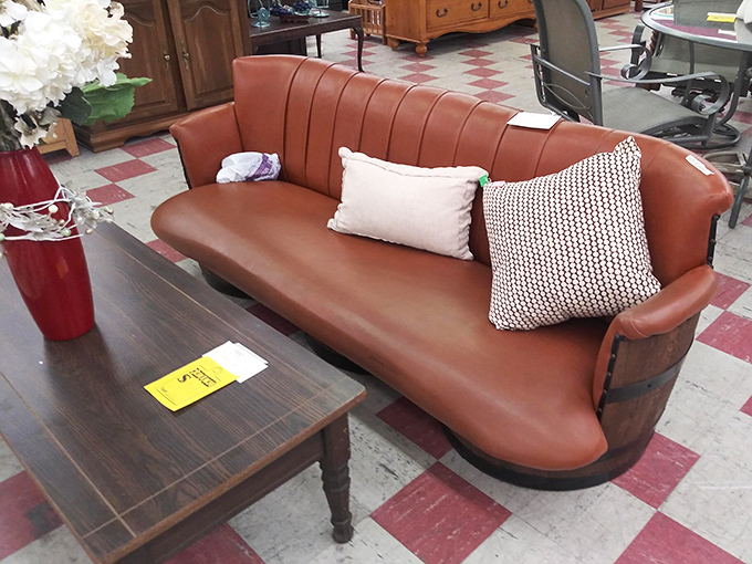 This mid-century leather beauty isn't just a couch—it's a statement piece waiting for its second act.