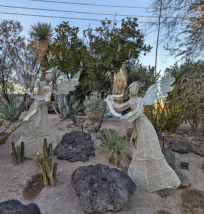 Angel sculptures bring a touch of whimsy to the desert landscape. Even heavenly beings appreciate a good cactus garden.