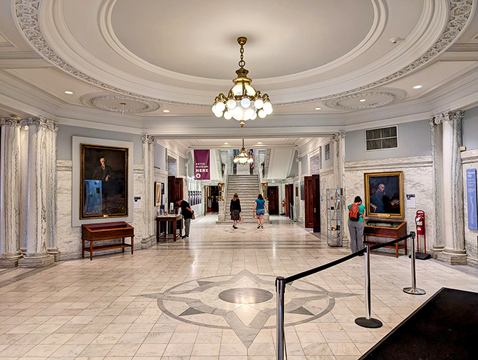 The main entrance hall's gleaming marble and elegant chandelier set a surprisingly sophisticated stage for the medical curiosities that await.