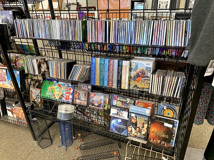 Media nostalgia on display! DVDs and CDs stand like artifacts from a not-so-distant past when we physically owned our entertainment.
