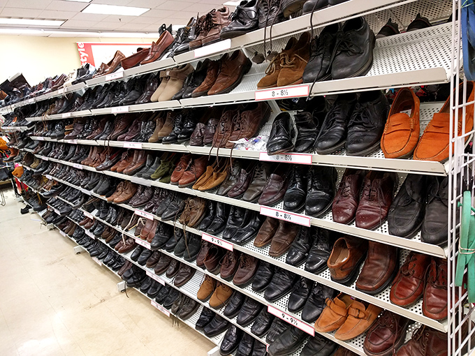 The men's shoe section: where barely-worn leather loafers and pristine work boots await their second chance at sidewalk stardom.