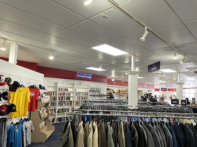 The men's department: where business suits and casual classics hang side by side. Books and media nearby for the reluctant shopper who needs entertainment.