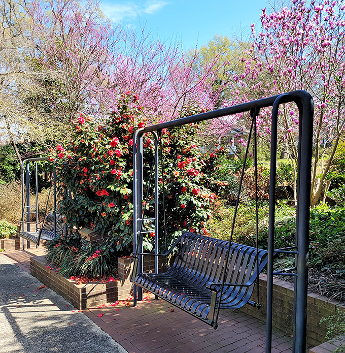 Garden swings: where adults can legitimately feel like kids again without explaining themselves to anyone. Pure joy, suspended.
