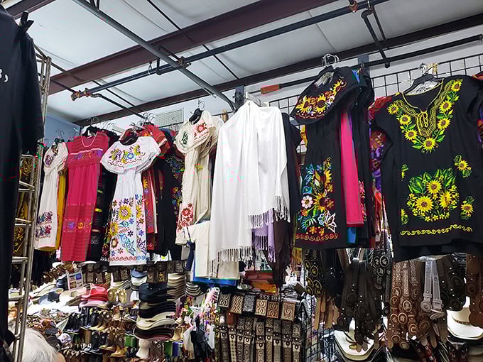 Embroidered Mexican dresses hang like wearable art galleries, each stitch telling stories of tradition, craftsmanship, and cross-border style that defies fashion trends.