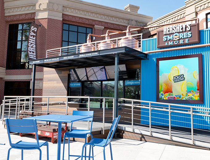 The Hershey's S'mores Store outdoor seating area offers a bright blue respite for chocolate-weary travelers needing to recharge before the next sugar rush.