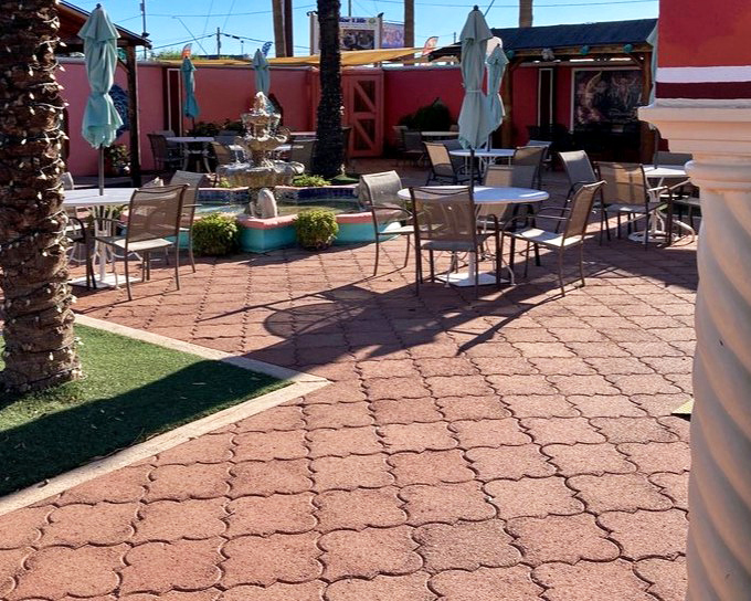 A fountain gently bubbles in the courtyard dining area, providing the soundtrack to your meal that no Spotify playlist could match.
